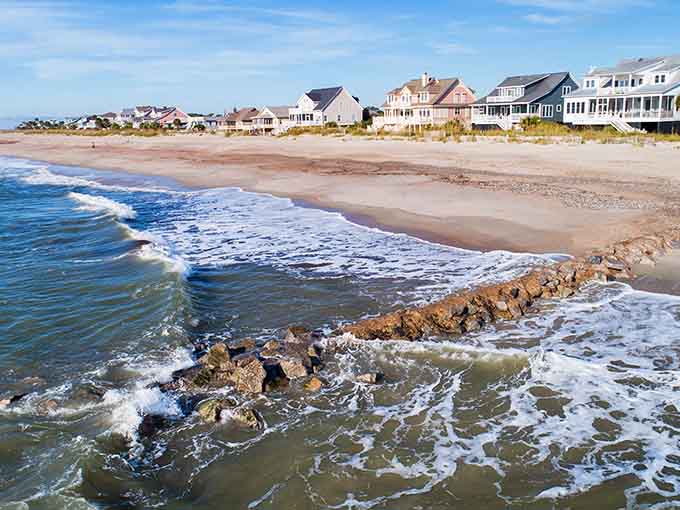 Ancient rocks meet rolling waves where Edisto's shoreline creates a natural masterpiece worth every sandy footprint.