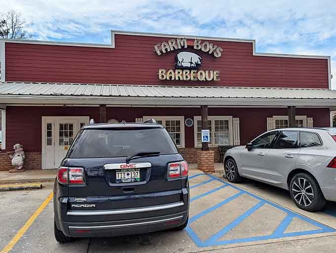 That red barn-style building with the pig logo is your first clue that serious barbecue awaits inside.