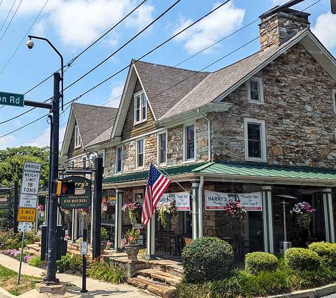 That gorgeous stone building with hanging flowers proves hot dogs taste better when served with architectural charm and character.