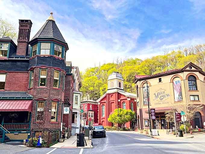 Victorian towers and painted facades create a storybook scene that rivals any European mountain village you've ever dreamed about.
