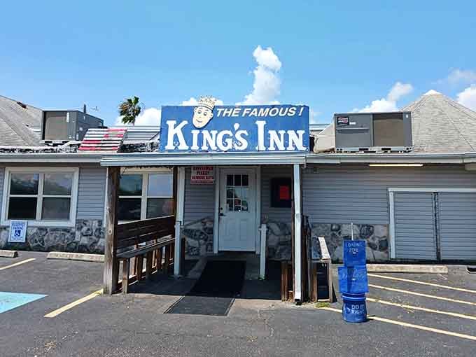 That cheerful sign and coastal breeze promise endless fried shrimp that'll make your taste buds sing.