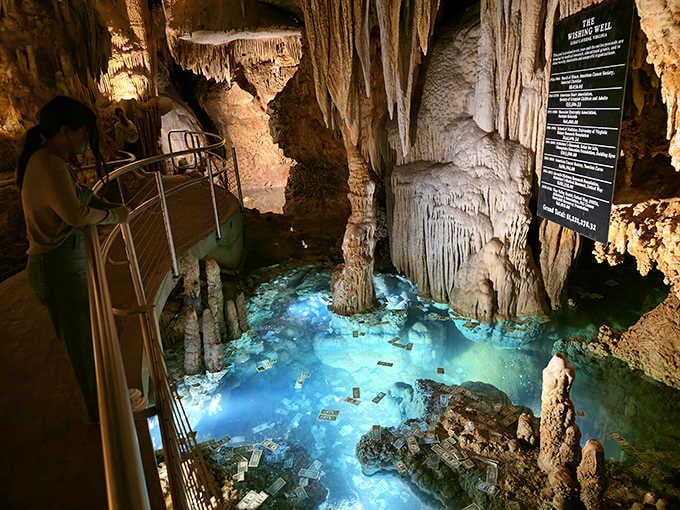 Mother Nature's underground ballroom glows like a turquoise dream, complete with stone chandeliers that took millions of years to hang.