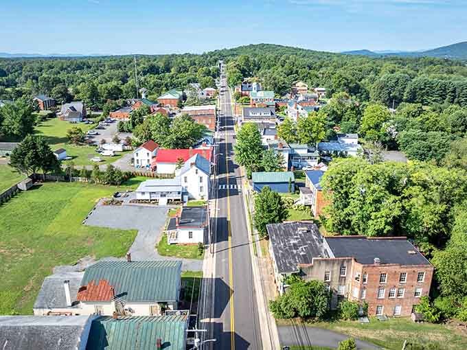 Aerial view reveals Madison's tree-canopied streets stretching toward distant mountains&mdash;a postcard-perfect escape from the modern world's relentless noise.