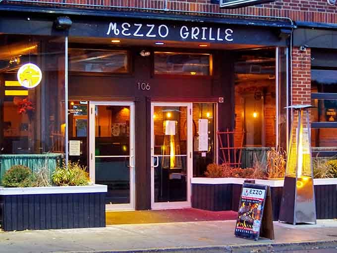 Mezzo Grille's welcoming entrance glows with warmth, promising Mediterranean flavors hiding in downtown Middletown's heart.