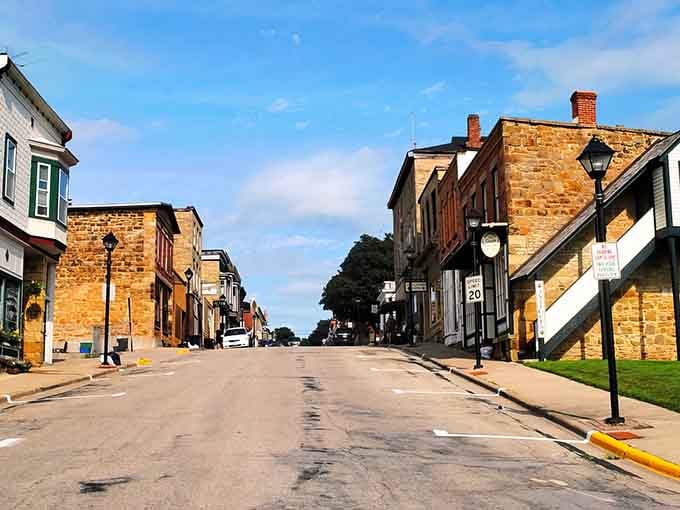 These golden limestone buildings glow like butter in the afternoon sun, creating a Main Street worth savoring slowly.