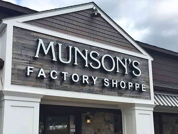 That "Factory Shoppe" sign promises fresh chocolate magic happening right behind those doors—your sweet tooth just perked up.