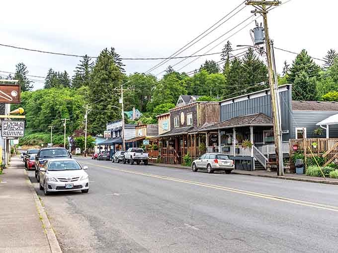 Wooden storefronts and evergreen hills create a coastal scene that feels like stepping into a Norman Rockwell painting.