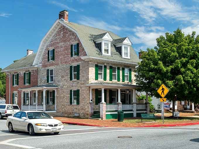 This stately brick beauty with green shutters stands proud like a monument to slower times and better manners.
