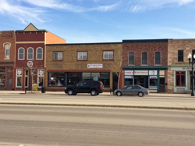 Classic brick storefronts line this peaceful main street where time slows down and neighbors still wave hello.