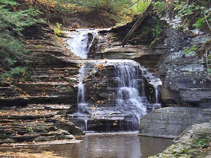 Autumn's gentle touch transforms these layered falls into a masterpiece of water and stone.