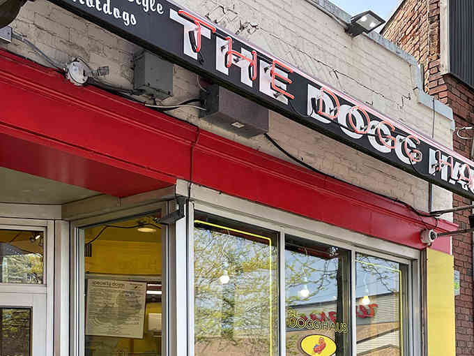 That bold red awning against classic brick tells you everything: this place means business about hot dogs.