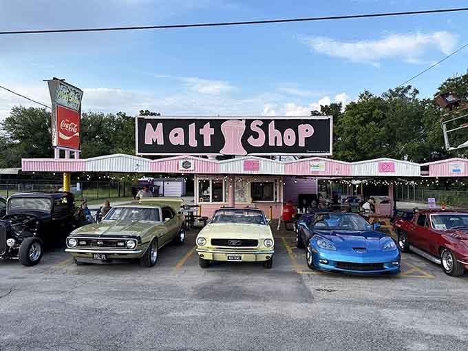 Classic cars parked outside a pink paradise&mdash;this looks like Happy Days meets your sweetest milkshake dreams!