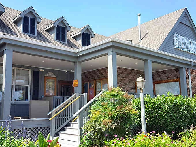 Those charming dormer windows and welcoming front porch promise the kind of waterside dining dreams are made of.