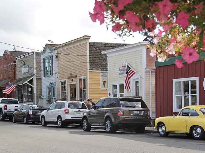 Historic storefronts wearing their colors like Sunday best, proving small-town charm never goes out of style.