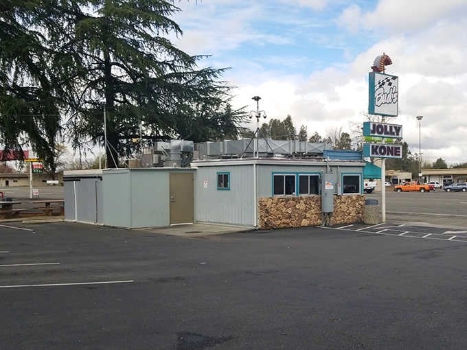 That vintage sign towering above the parking lot isn't just decoration; it's a beacon calling hungry travelers home.