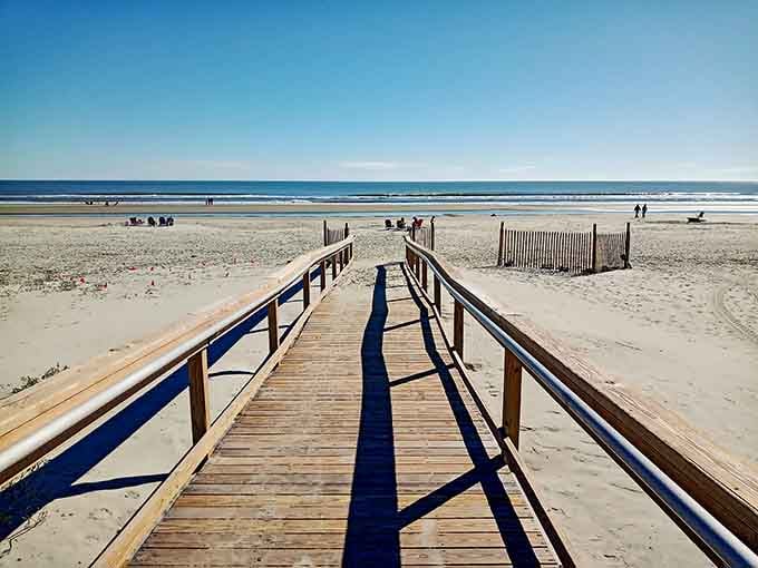 That boardwalk stretching toward paradise is your official invitation to leave your worries behind in the parking lot.