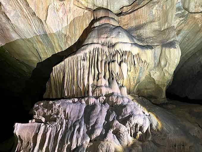 Nature's cathedral reveals itself in layers of cream and amber, each formation a testament to patience beyond human comprehension.
