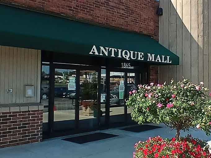 That green awning and classic brick facade promise treasures waiting just beyond those doors.