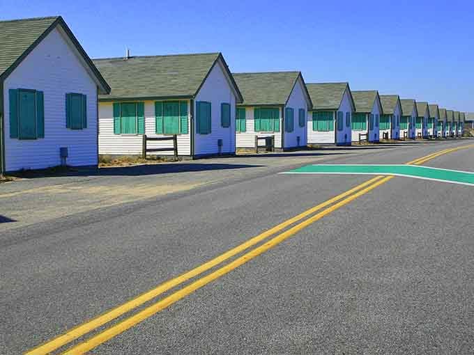These charming beach cottages line up like a pastel rainbow, each one waiting for summer memories to unfold.