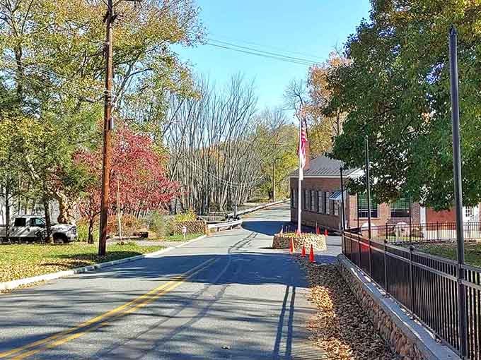 Autumn leaves carpet this charming Warren County road where historic buildings whisper stories from centuries past.