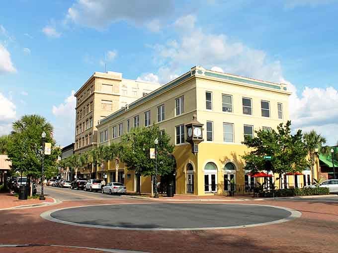 Downtown Winter Haven's historic buildings frame a peaceful roundabout where palm trees sway and time slows down beautifully.