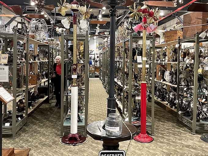 Rows of antique fans stand like metallic sculptures, each one a testament to pre-air-conditioning ingenuity and style.