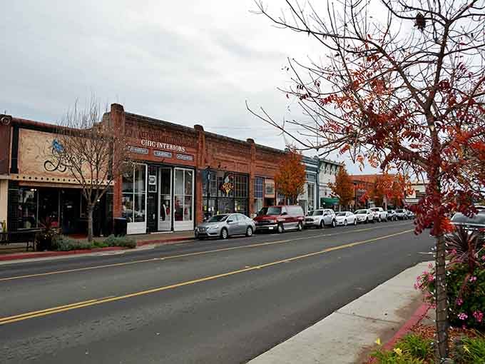 Autumn leaves frame this charming downtown street where antique shops and cafes invite you to slow down completely.