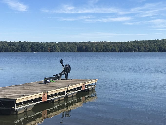 A solitary dock stretches into endless blue, inviting you to sit and contemplate absolutely nothing for hours.