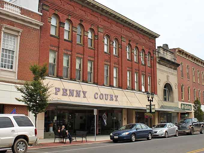 The Penny Court marquee stands proud against historic facades where every building tells its own American story.
