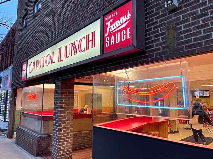 That glowing neon hot dog sign isn't just decoration&mdash;it's a beacon calling you to steamed perfection and timeless flavor.