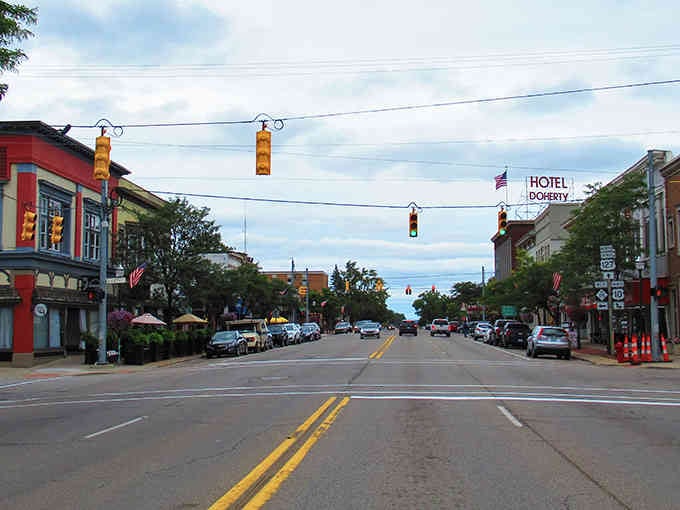 Wide streets and vintage storefronts create a postcard-perfect scene that hasn't changed in generations.