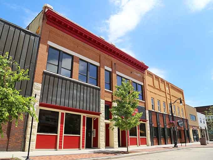 Those bold red accents pop against historic brick, proving old and new can dance together beautifully.