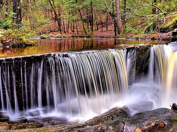 That perfect autumn reflection makes this wide curtain of water look like nature's own mirror.