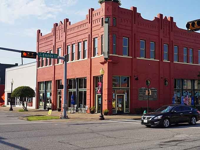 That red brick building stands proud like it's been holding court on this corner since forever.