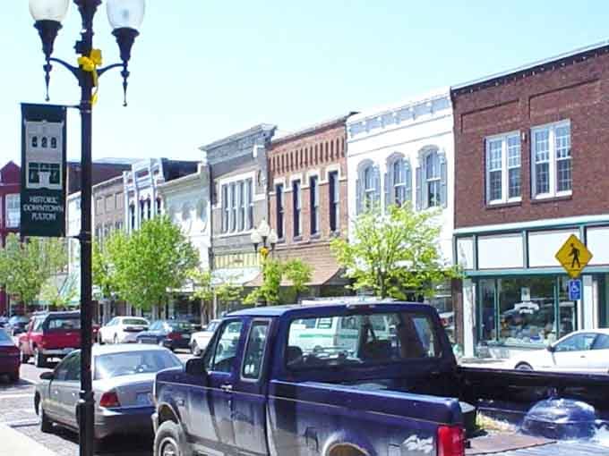 Classic storefronts stand shoulder to shoulder like old friends who've weathered every storm together for generations.