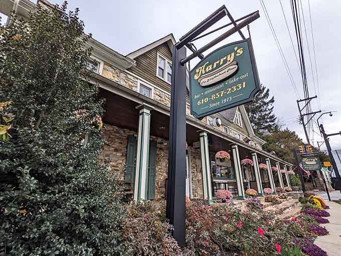 Harry's classic sign beckons from this beautifully maintained stone structure where tradition meets perfectly grilled hot dogs every single day.