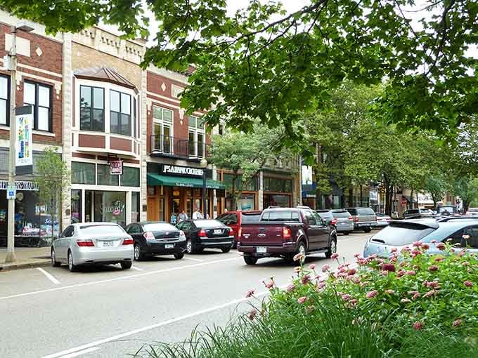 Summer greenery frames this bustling street scene where historic buildings meet modern life in perfect harmony.