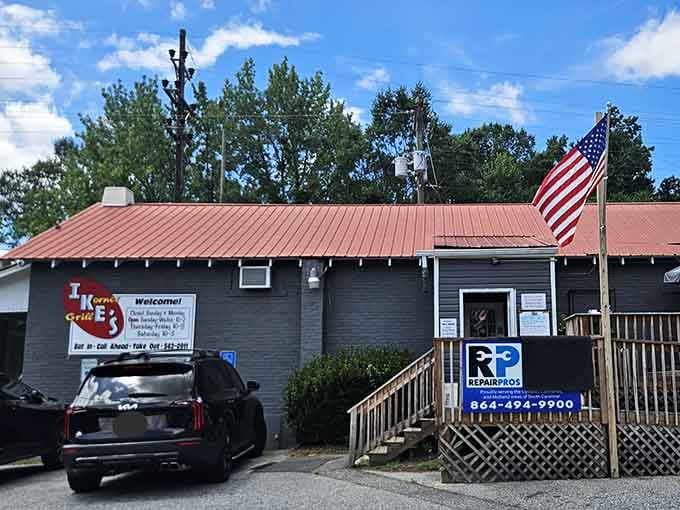 The American flag flying proudly tells you this is a place that serves honest, no-nonsense comfort food daily.