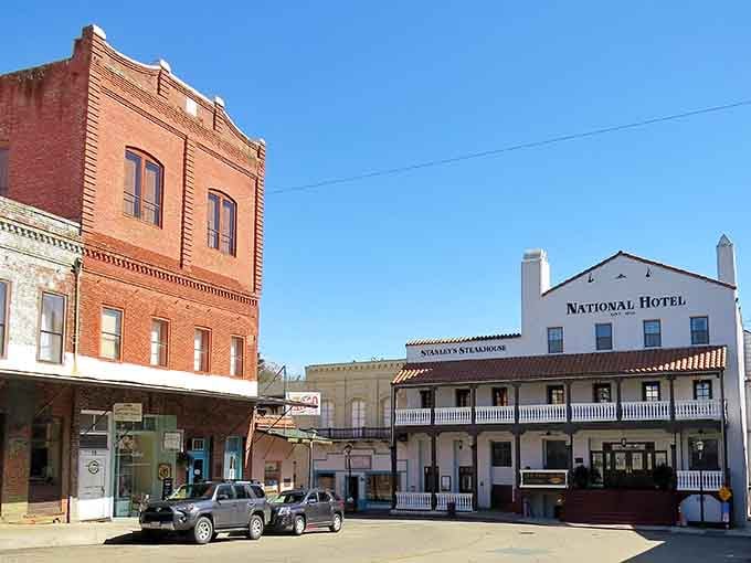 The National Hotel's white facade stands proud among brick neighbors, a testament to California's enduring frontier spirit and hospitality.