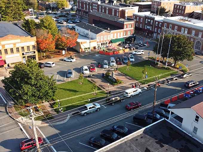 That town square surrounded by historic brick buildings is where neighbors still gather like it's 1950, only better.
