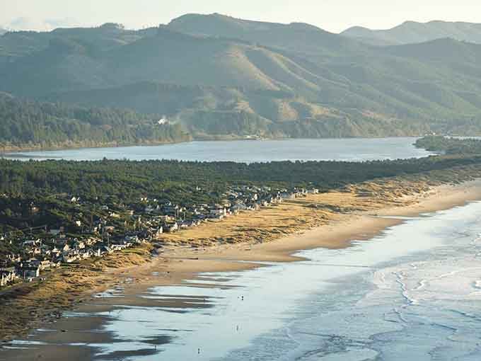 Bright sunshine illuminates the endless shoreline where the Pacific kisses the sand and mountains embrace this peaceful retreat.
