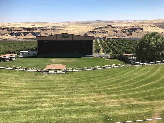 The amphitheater stage sits ready for summer concerts where wine and music meet under endless Washington skies.
