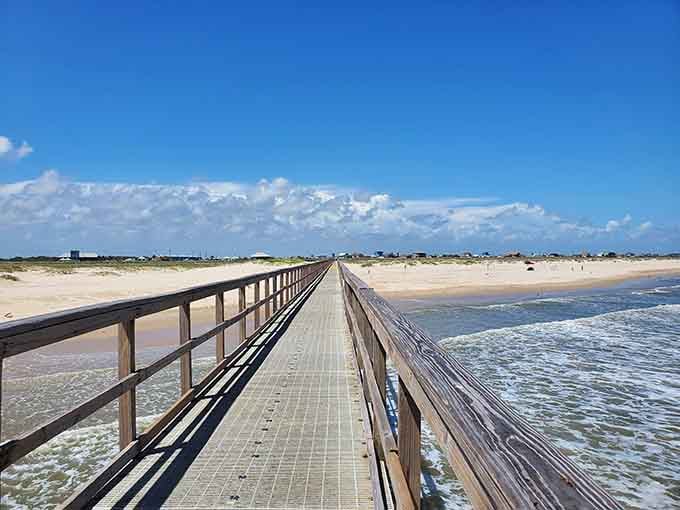 This boardwalk leads straight to paradise, where golden sand meets endless blue sky in perfect harmony.