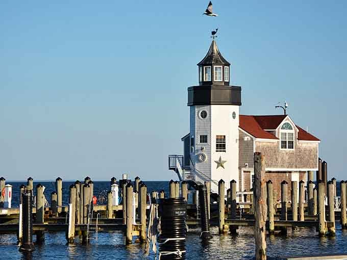 That lighthouse standing proud on weathered pilings looks like it stepped out of a maritime painting.