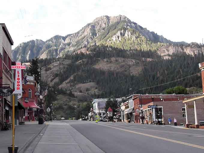 Main Street stretches toward mountains that rise like natural skyscrapers, creating Colorado's most dramatic small-town backdrop.