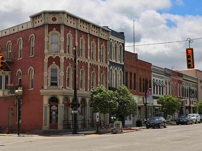 These ornate Victorian buildings stand proud, their arched windows watching over the street like wise old friends.