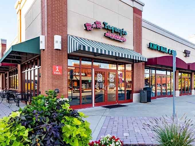 The landscaped entrance with cheerful flowers hints that someone here cares deeply about your entire dining experience.