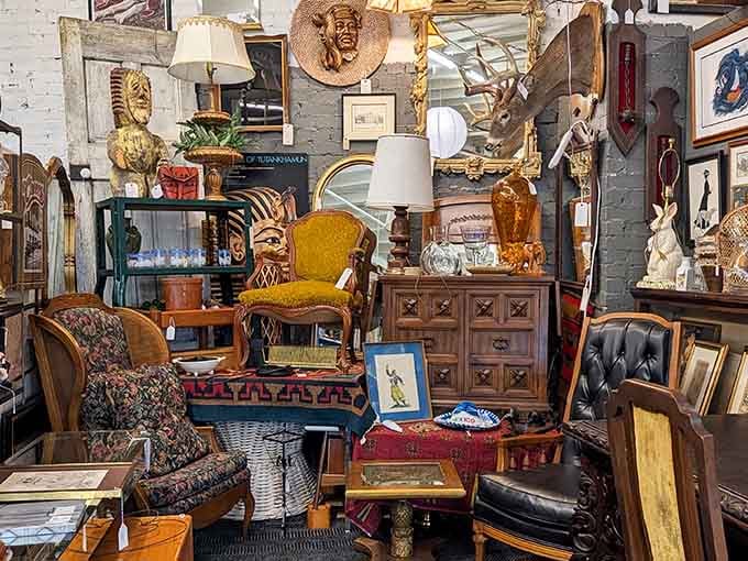 Golden Egyptian busts meet mustard velvet chairs in this glorious collision of decades and design dreams.