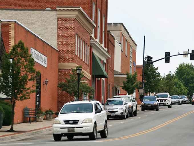 Brick storefronts line up like they're posing for a Norman Rockwell painting, and honestly, they're nailing it.