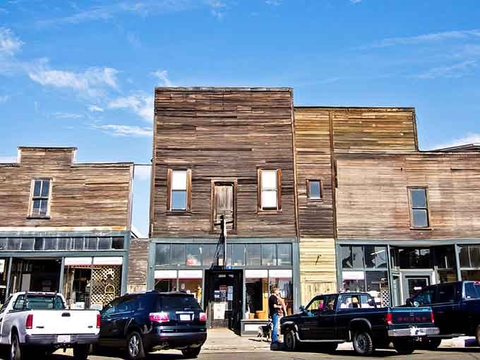 These weathered wooden storefronts have witnessed decades of stories, standing proud like characters in their own Western novel.